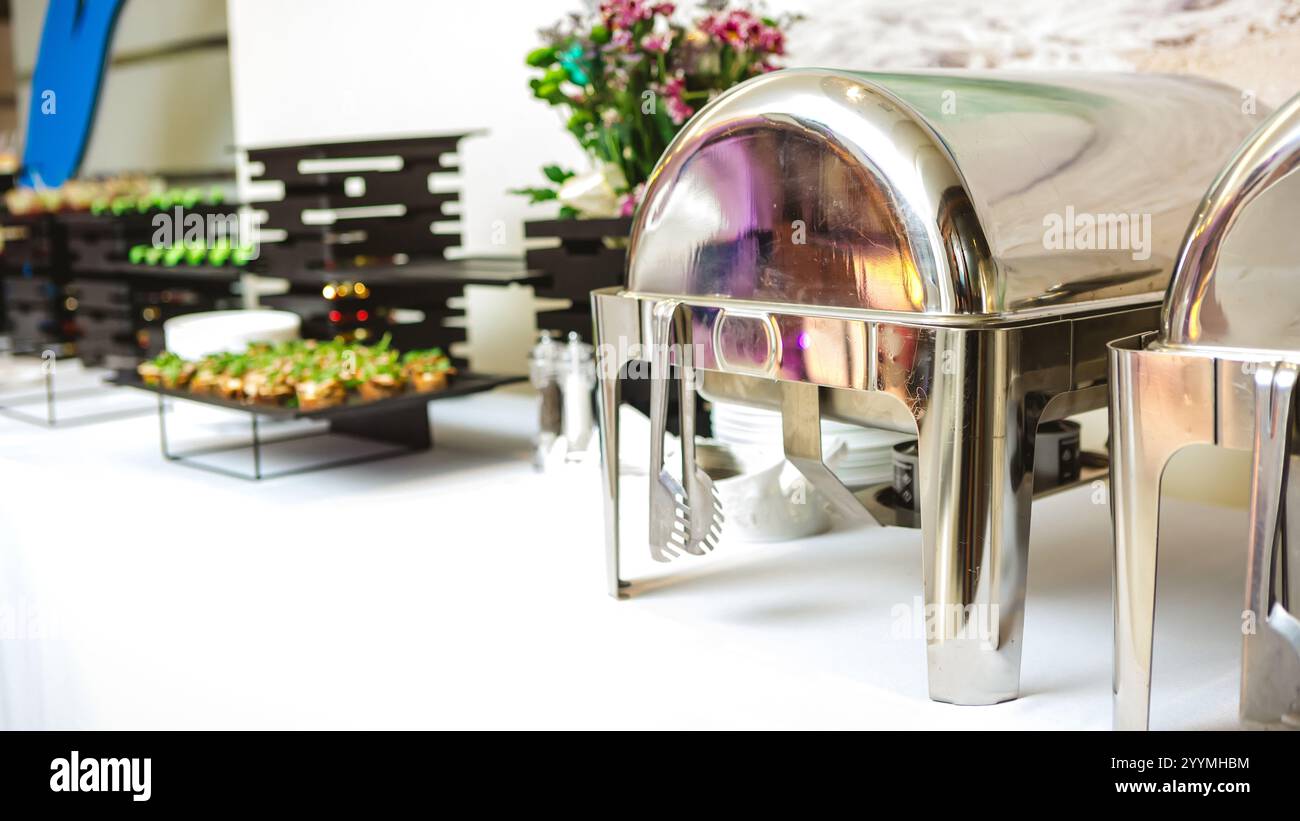 A contemporary hotel dining area featuring a sleek buffet setup and ...