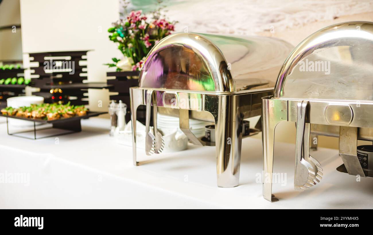 A contemporary hotel dining area featuring a sleek buffet setup and ...