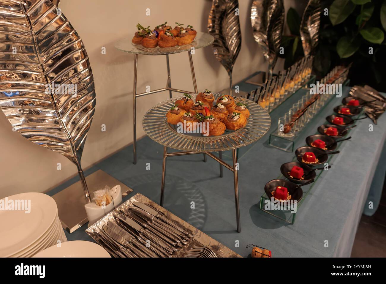 A contemporary hotel dining area featuring a sleek buffet setup and ...