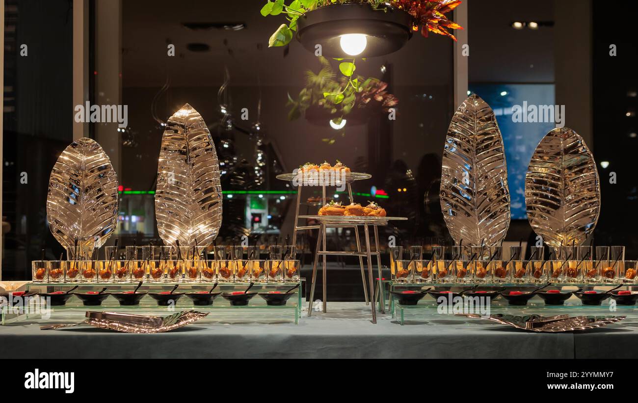 A contemporary hotel dining area featuring a sleek buffet setup and ...