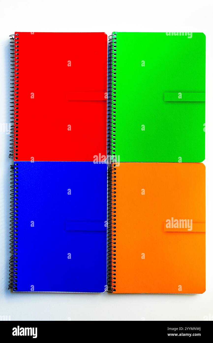 Red, blue, green and orange spiral notes on white background Stock ...