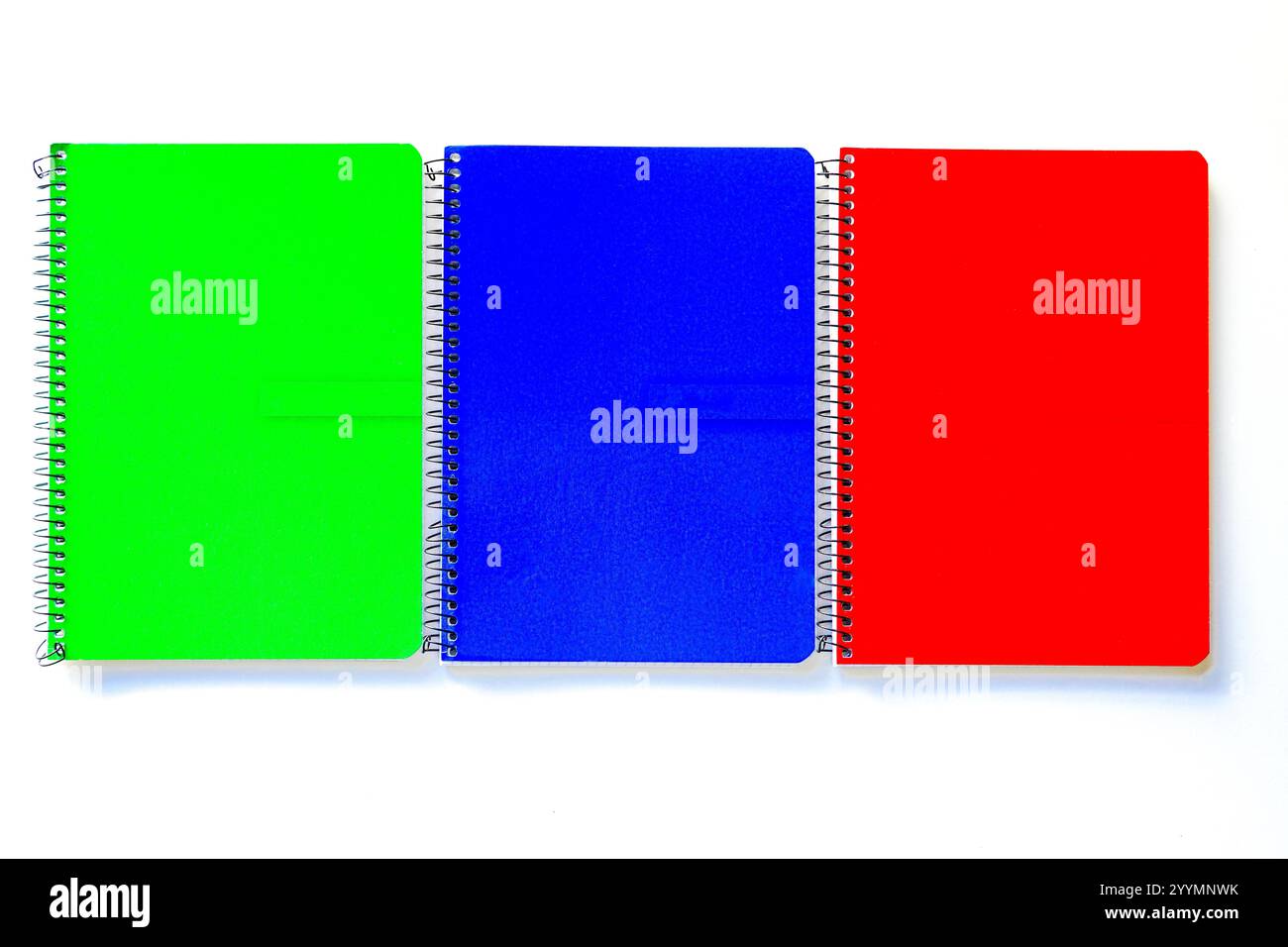 Red, blue and green and spiral notes on white background Stock Photo ...