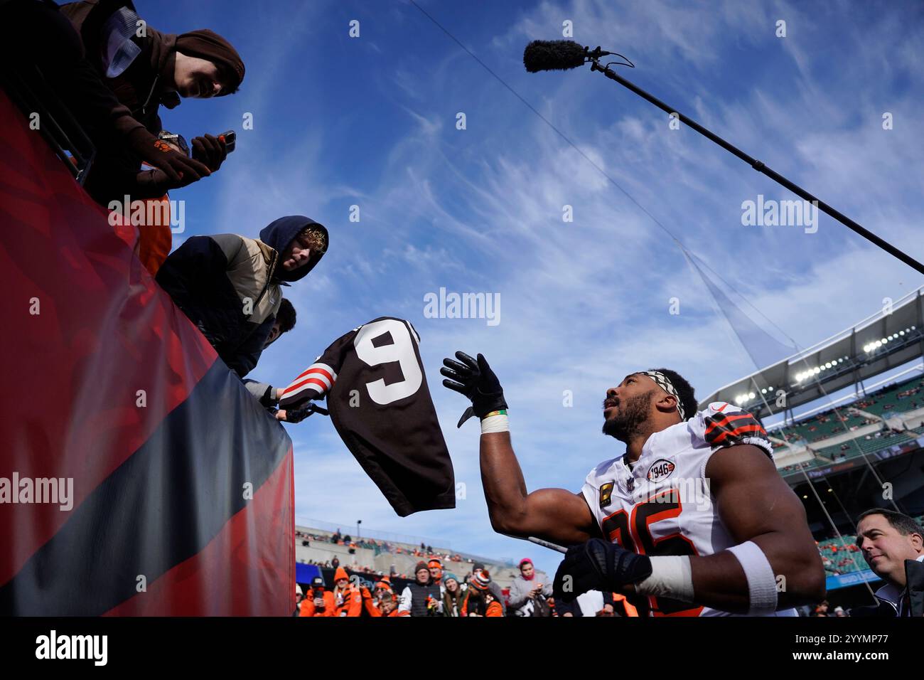 Cleveland Browns defensive end Myles Garrett (95) tosses a jersey to a ...
