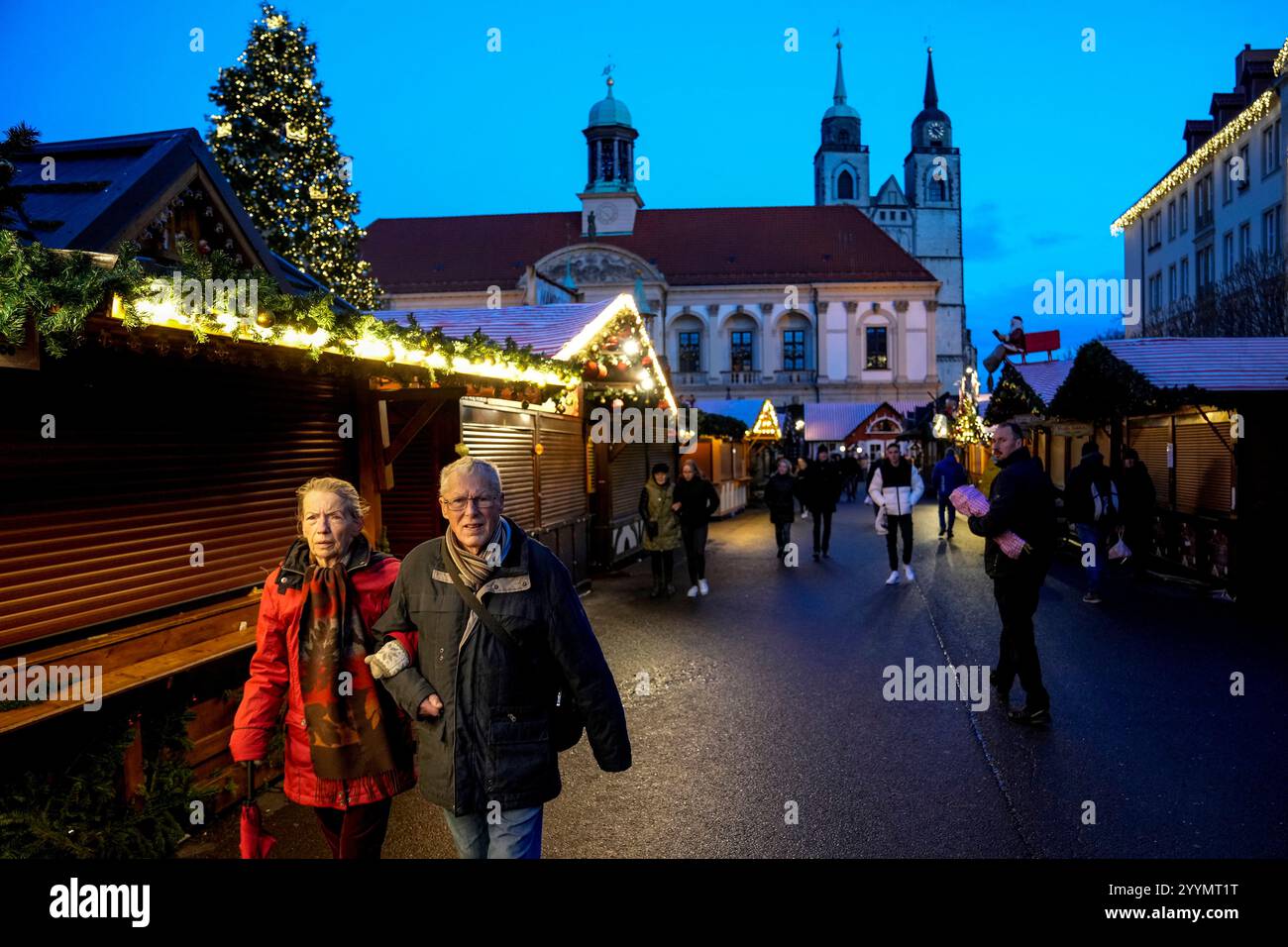 People walk at the Christmas Market, where a car drove into a crowd on ...