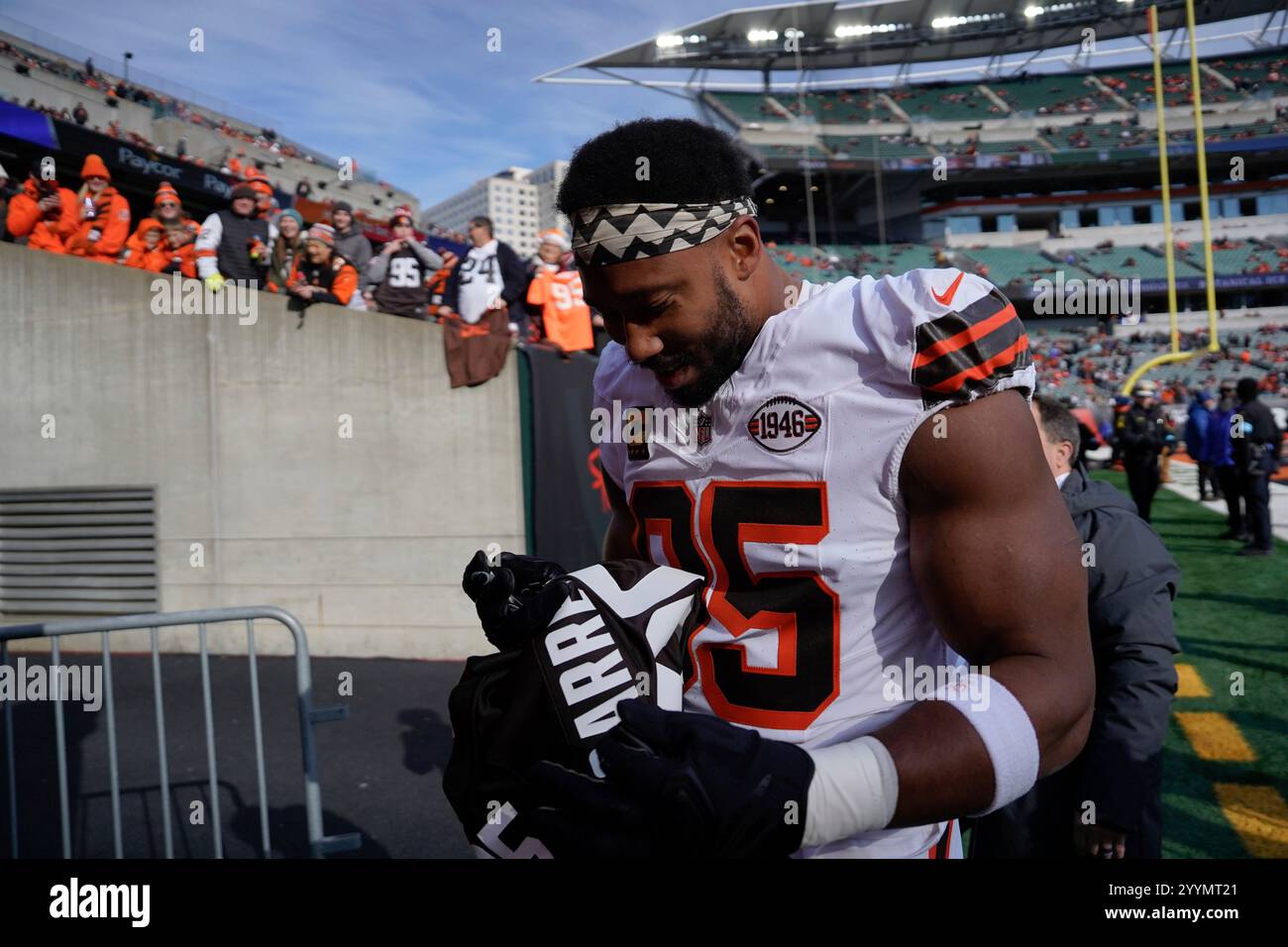Cleveland Browns defensive end Myles Garrett (95) signs a jersey for a ...