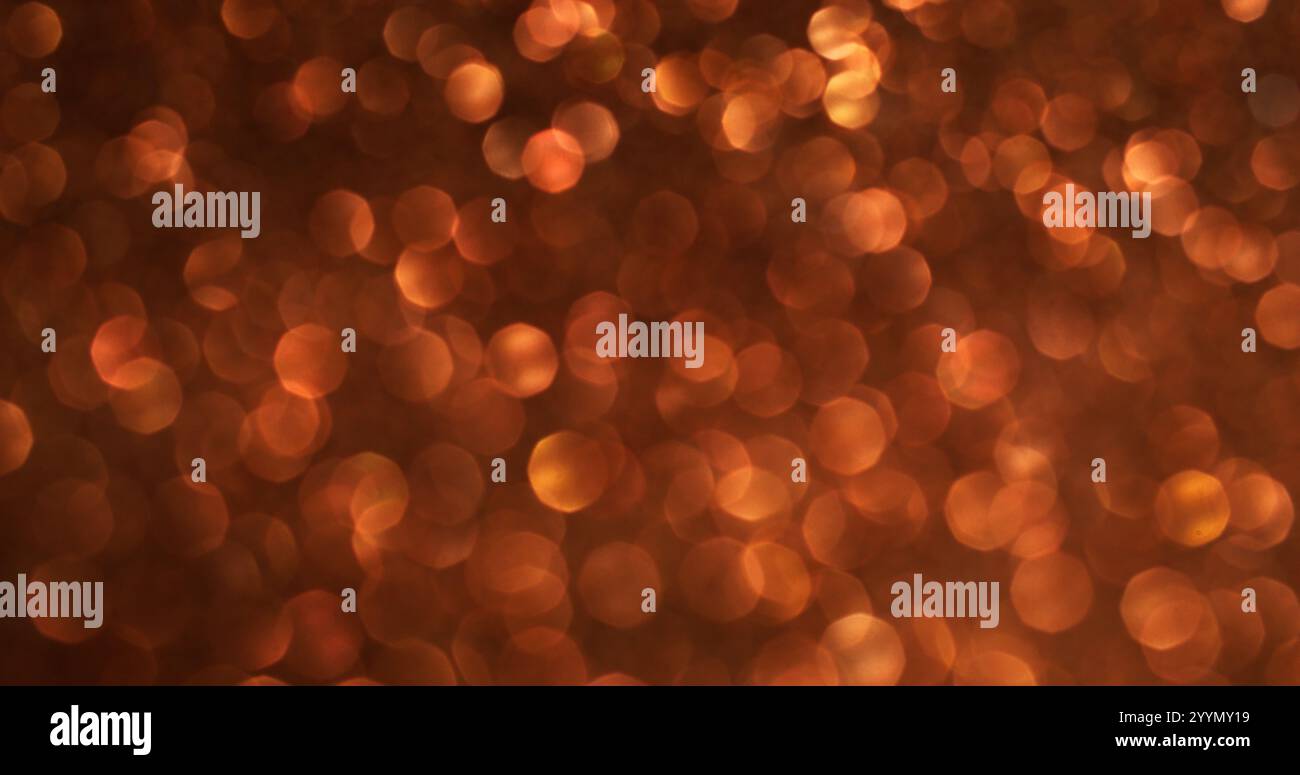 Blurred ray. Orange confetti. Shimmering round spots with smooth ...