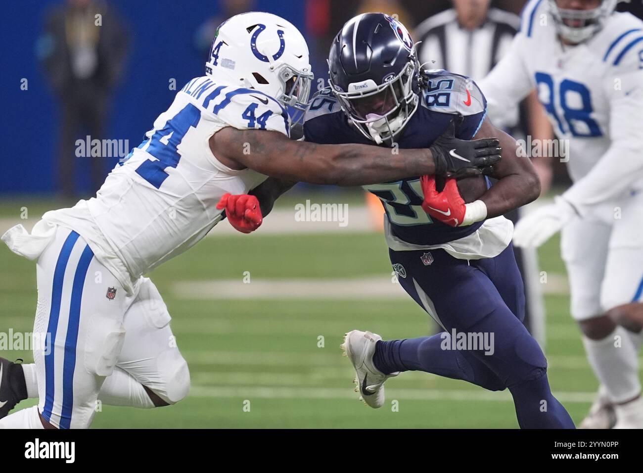 Tennessee Titans tight end Chig Okonkwo (85) runs past Indianapolis Colts linebacker Zaire ...