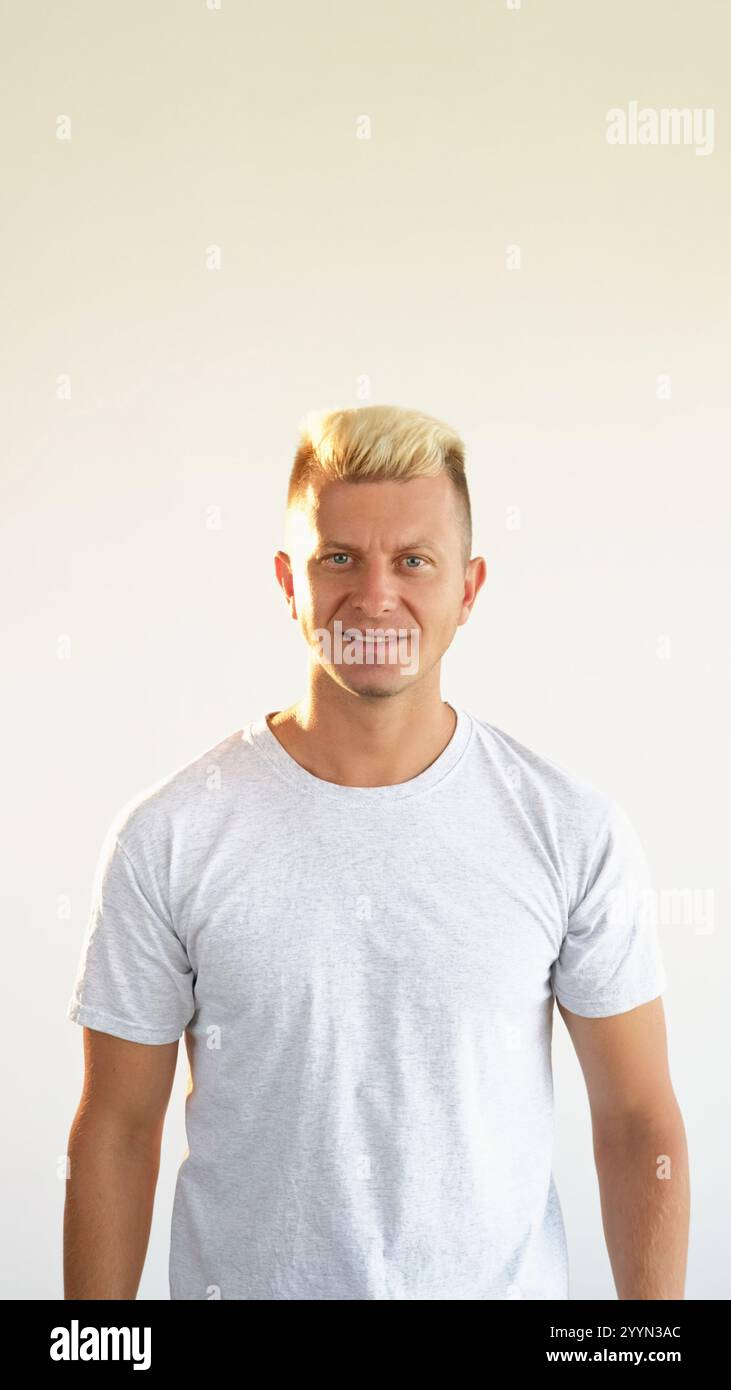 Man portrait. Masculine energy. Confident cheerful blond guy with ...