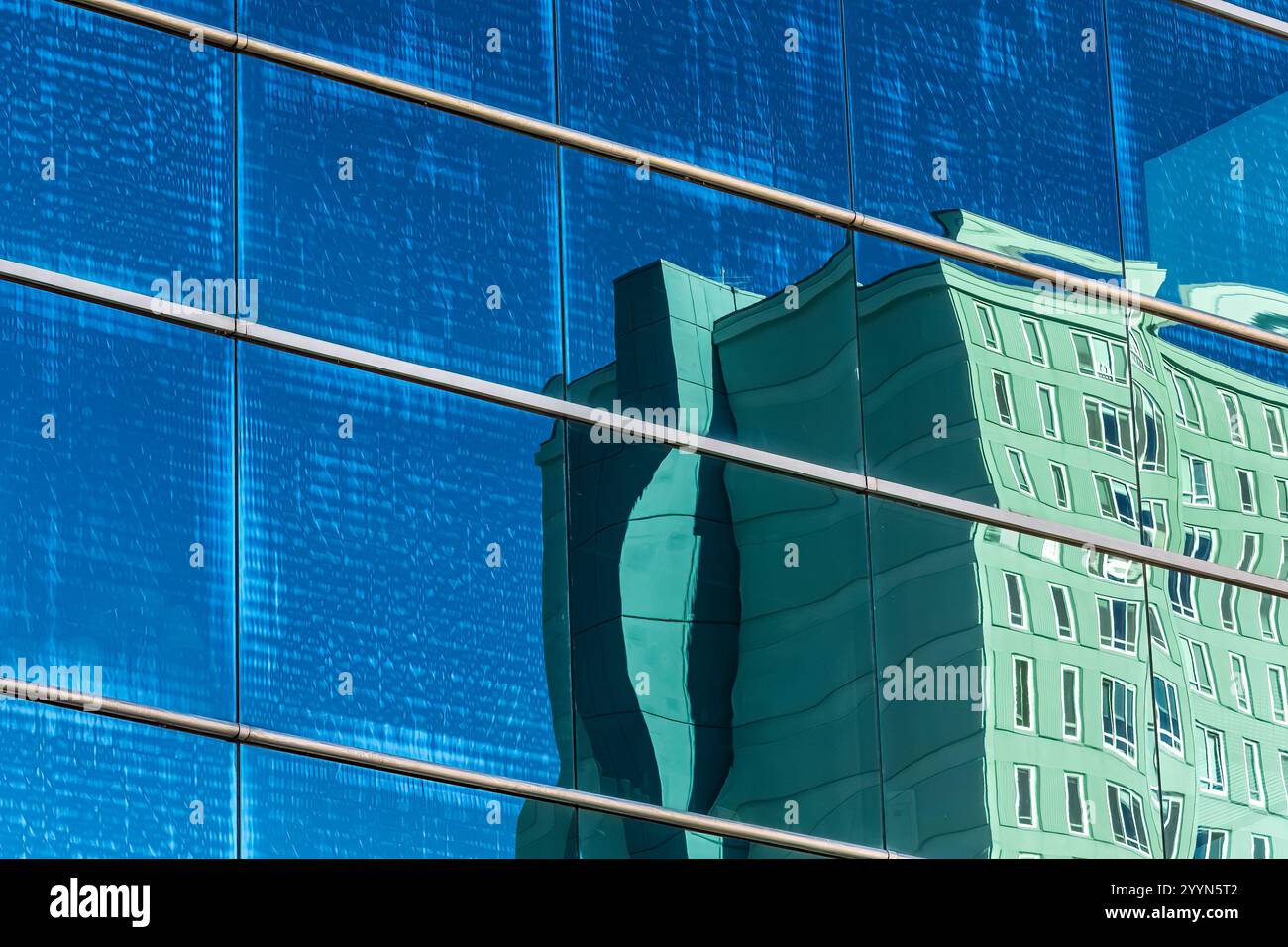 Condo building reflected in windows of other buildings in Seattle ...