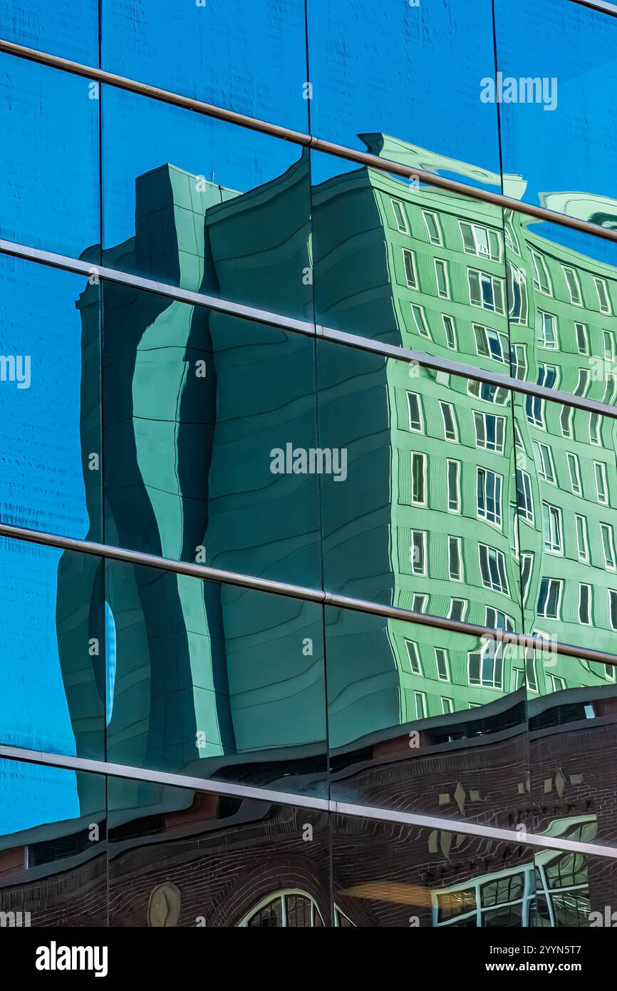 Condo building reflected in windows of other buildings in Seattle ...