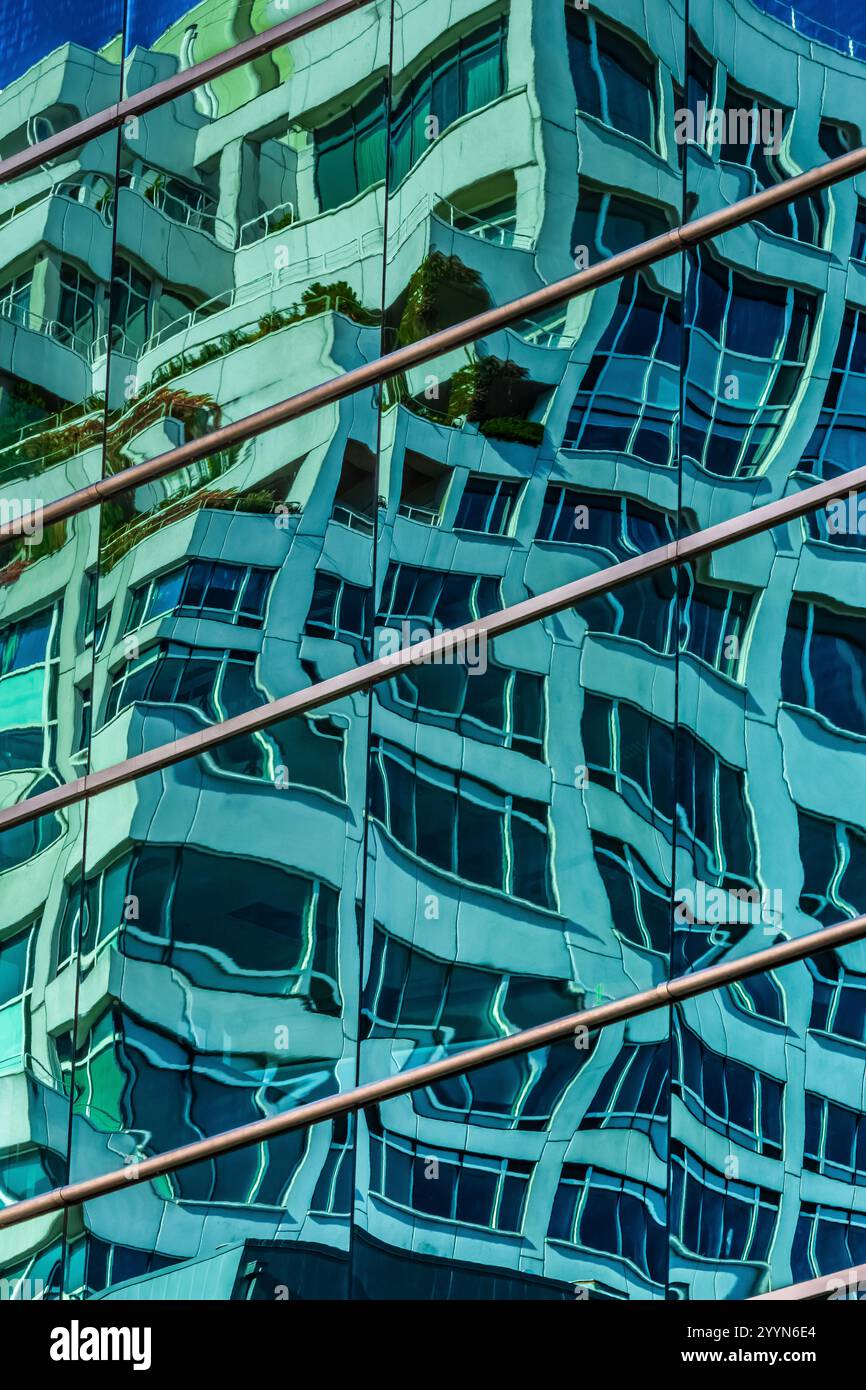 Condo building reflected in windows of other buildings in Seattle ...