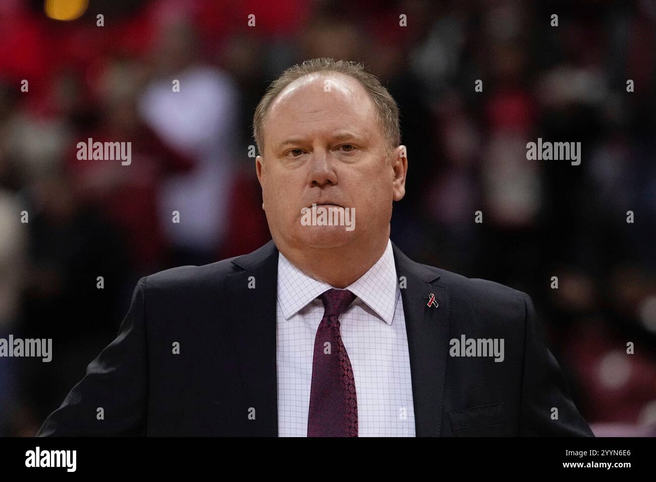 Wisconsin head coach Greg Gard watches warm ups before an NCAA college ...