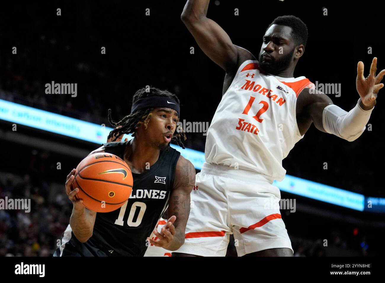 Iowa State guard Keshon Gilbert (10) passes around Morgan State forward ...