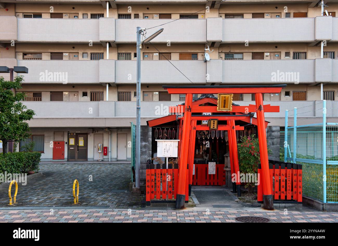 Strange juxtaposition of a mini Shinto shrine with vermilion torii ...