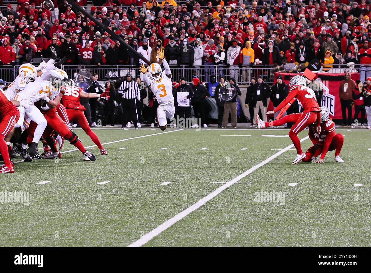 Columbus, Ohio, USA. 21st Dec, 2024. (3) Jermond McCoy (DB) tries to ...