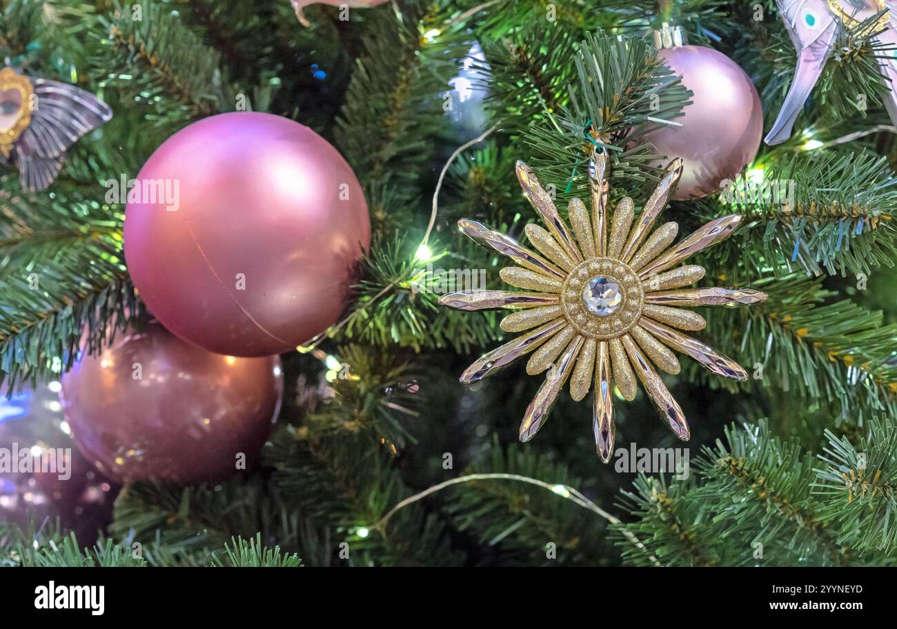 Golden snowflake with a large crystal in the middle on a Christmas tree ...