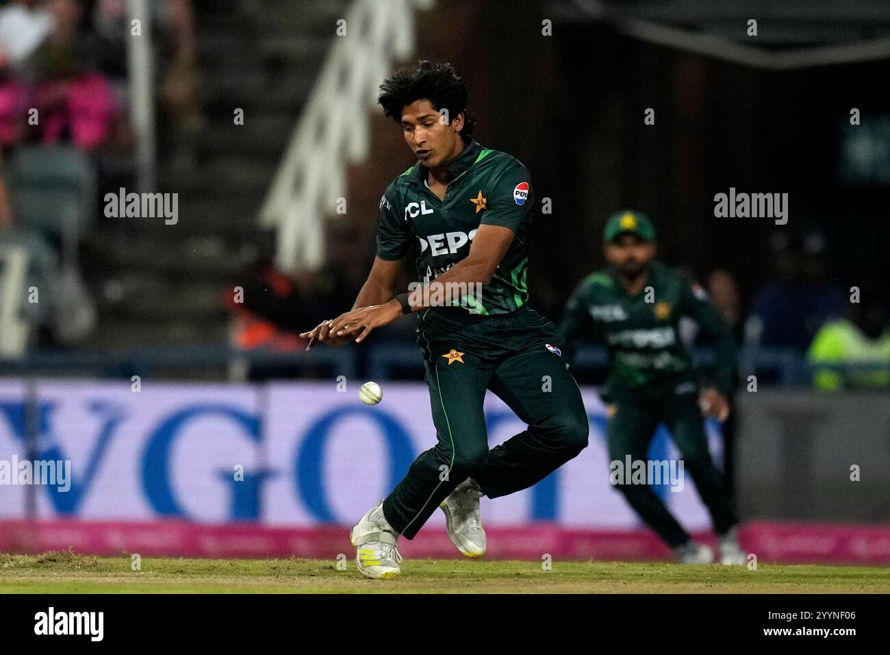 Pakistan's Mohammad Hasnain attempts a catch off his own bowling during the third International ...