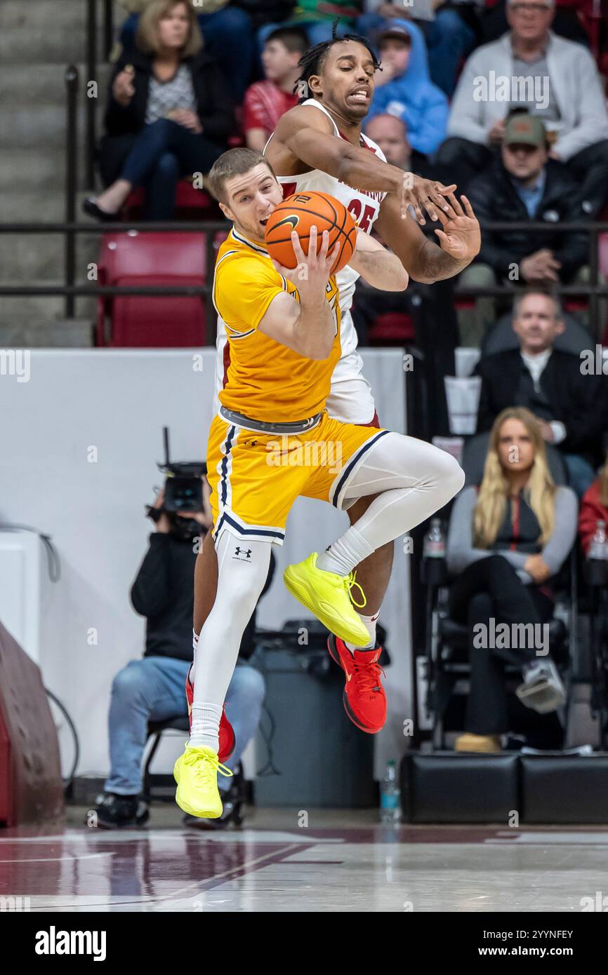 Kent State guard Mike Bekelja (15) rebounds the ball and draws a foul ...