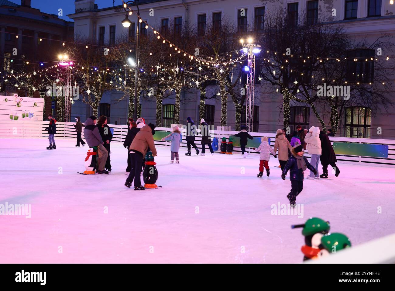 Enjoy a Vibrant Evening of Ice Skating Fun Set in a Lively City Rink ...