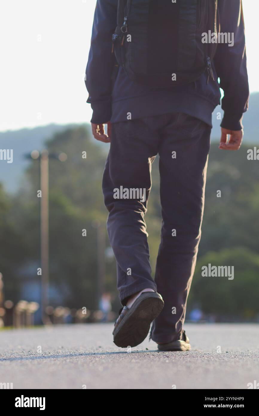 man is walking forward on path to his intended destination and his ...