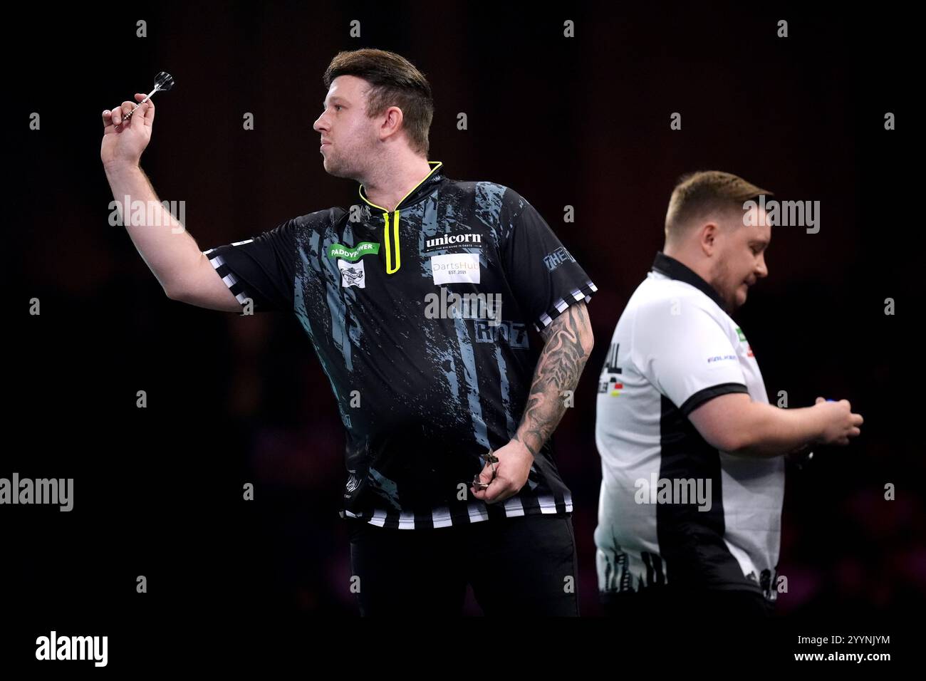 Callan Rydz throws during his match against Martin Schindler (right) on ...