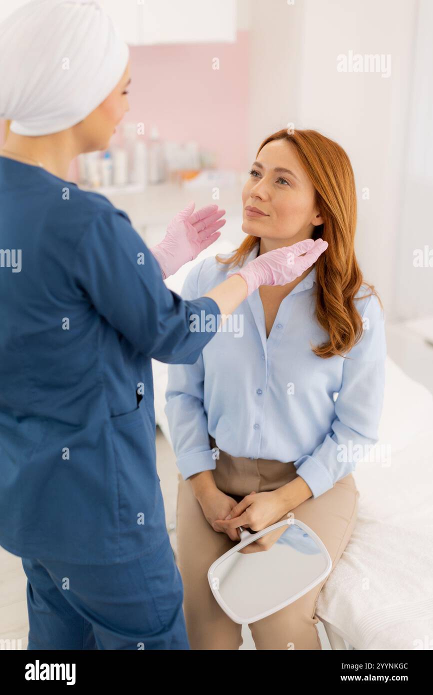 In a calming spa setting, a skincare professional guides a client ...