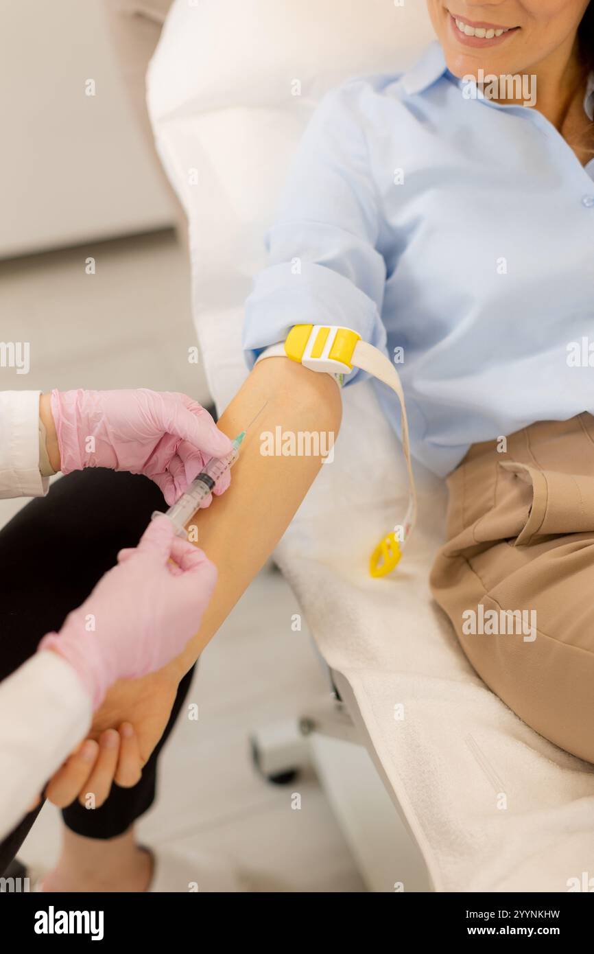 A patient sits comfortably while a healthcare professional prepares for ...