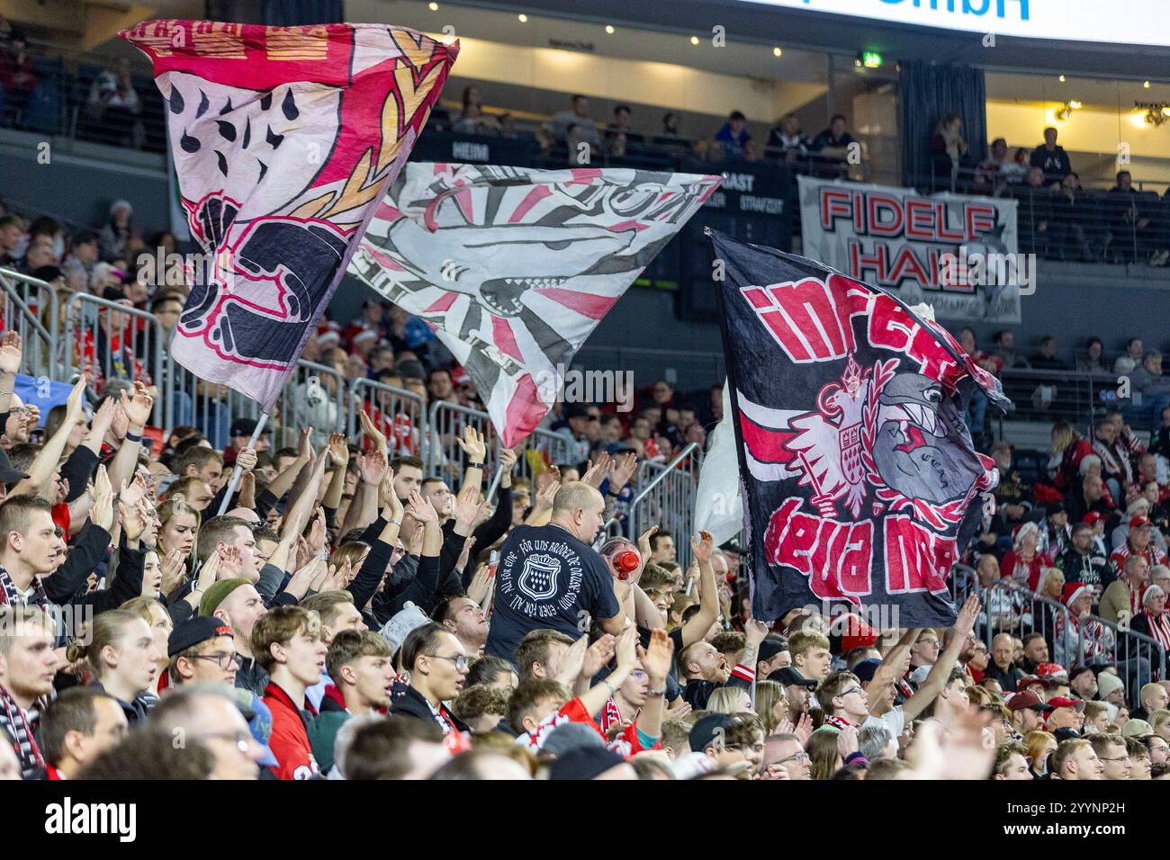Koeln, Deutschland. 22nd Dec, 2024. Die Fans der Koelner Hai jubeln ...
