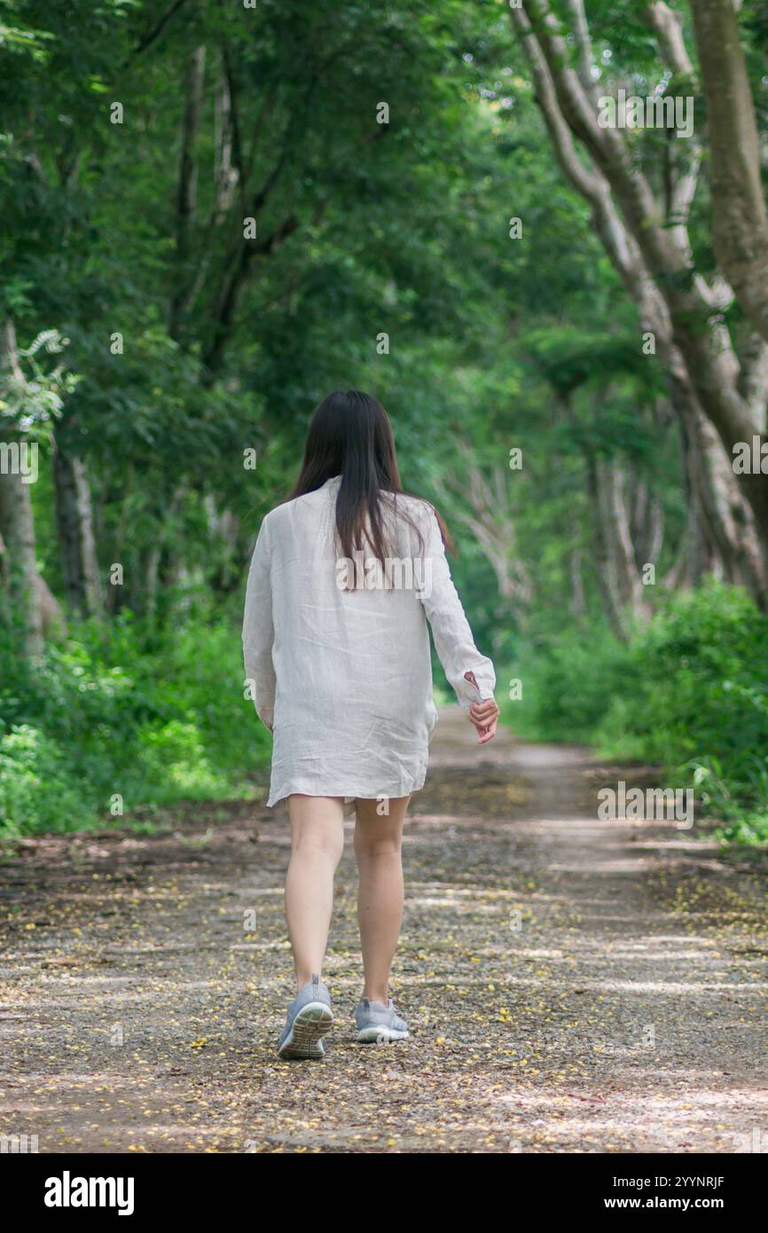 woman walking forward on the path to her intended destination and her ...