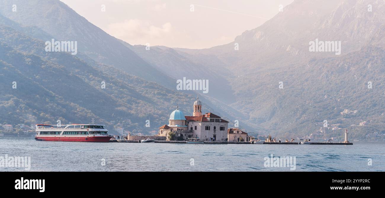 Ferry boat approaching the artificial island of Our lady of the rocks ...