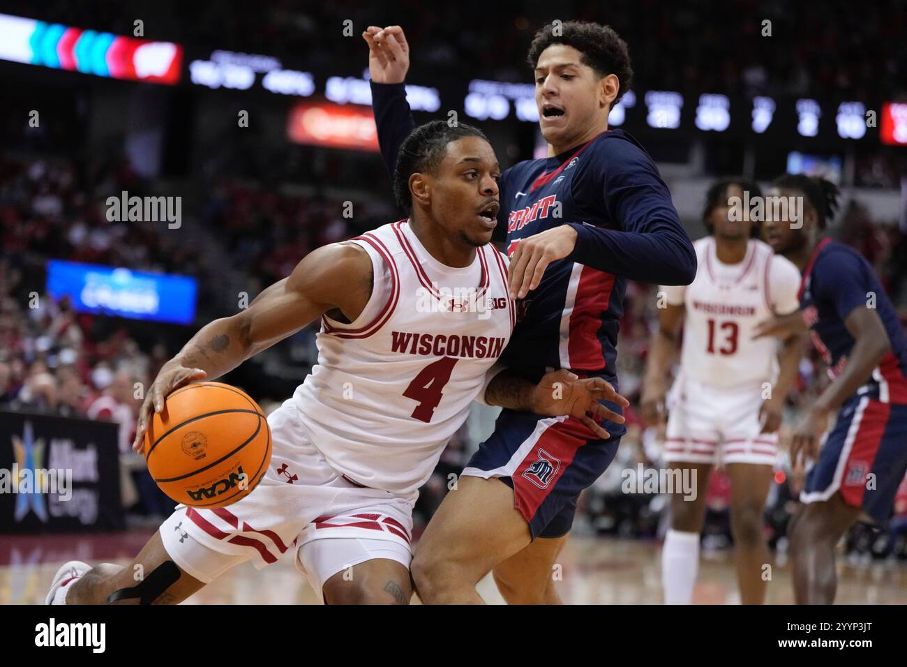 Wisconsin's Kamari McGee tries to get past Detroit Mercy's Grant ...
