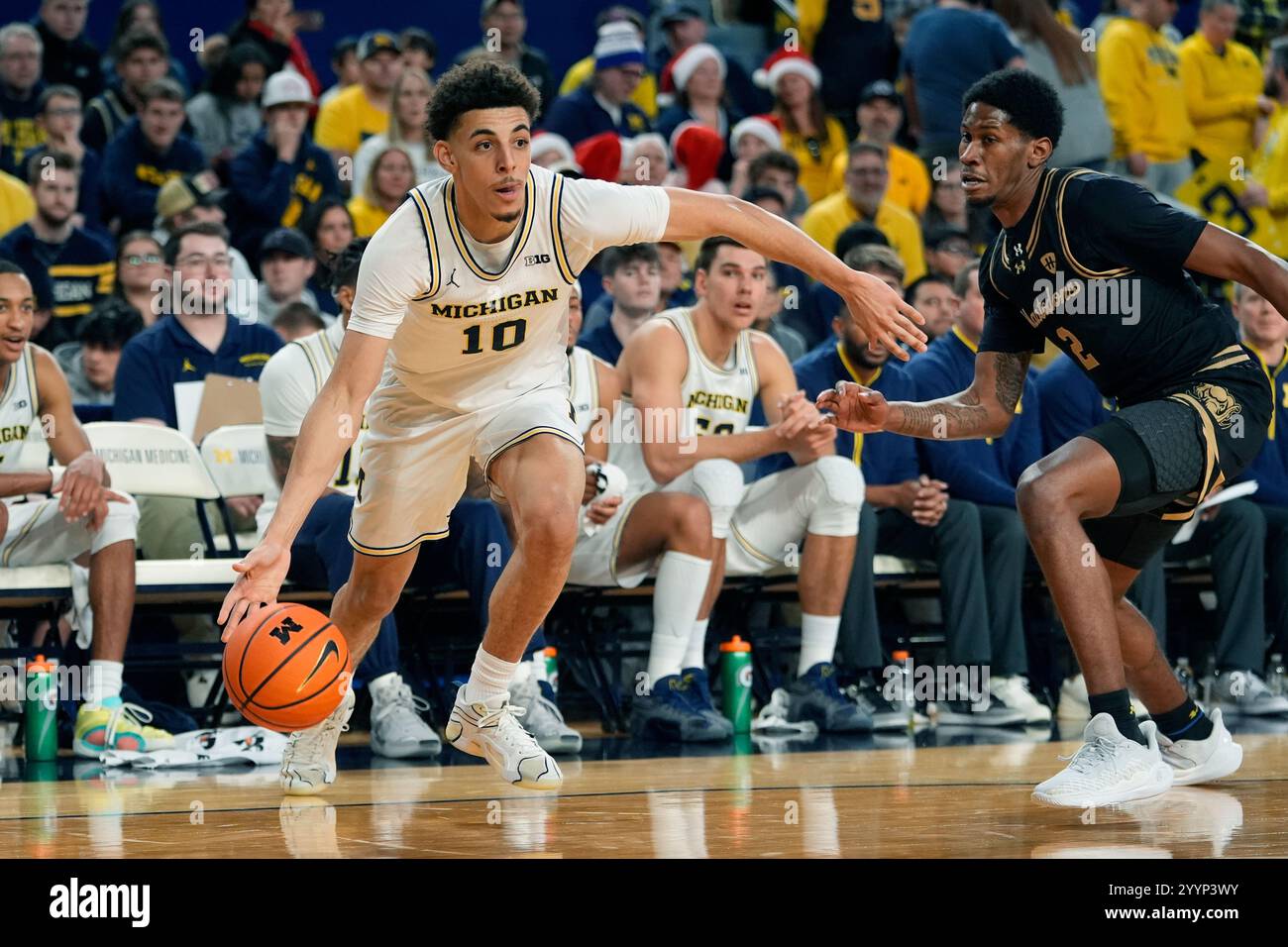 Michigan guard Justin Pippen (10) drives as IPFW guard Trey Lewis (2 ...