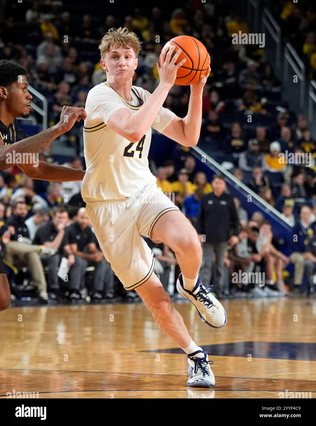 Michigan forward Sam Walters (24) drives during the second half of an ...