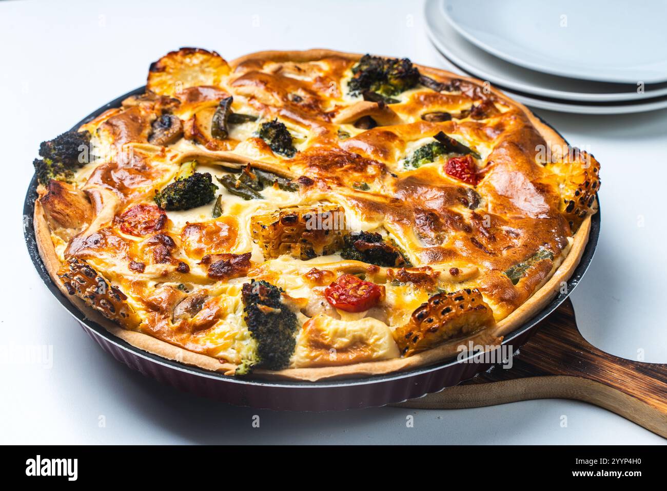 Raw Quiche with broccoli, corn, chicken and tomatoes is ready to bake ...