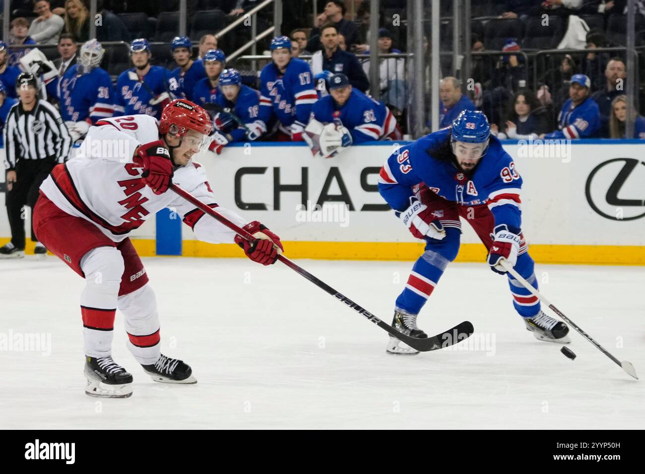 Carolina Hurricanes' Sebastian Aho (20) shoots the puck past New York ...