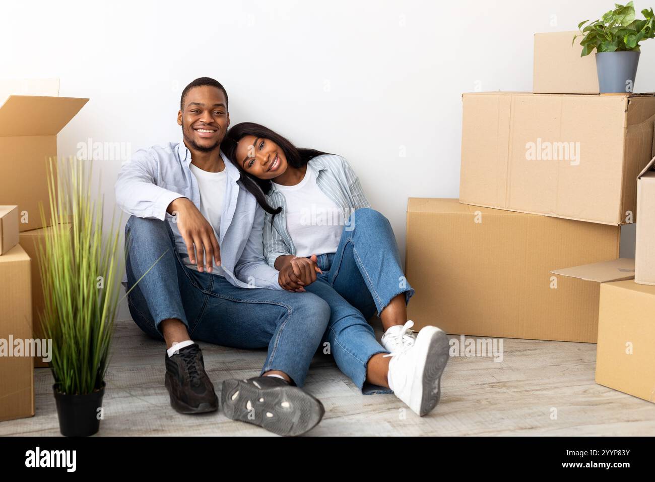 Real estate rent concept. Loving african american spouses relocating to ...