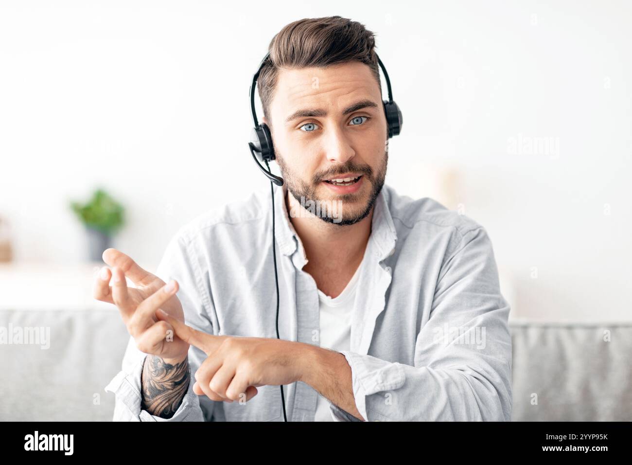 Remote job and online meeting. Serious man having web conference ...