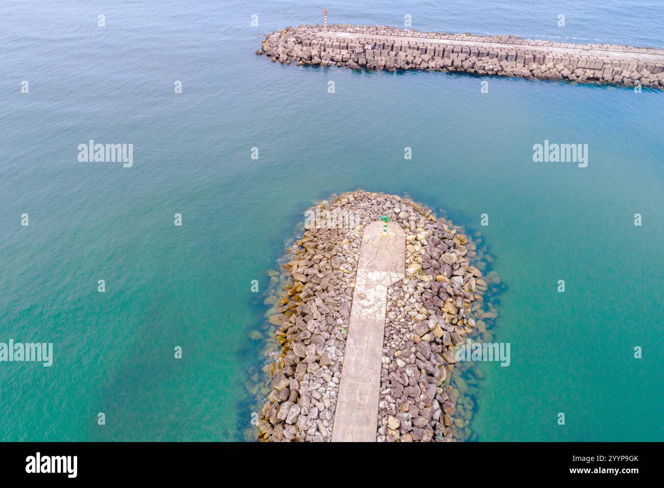 entrance of a port protected from the sea by two breakwaters, aerial ...