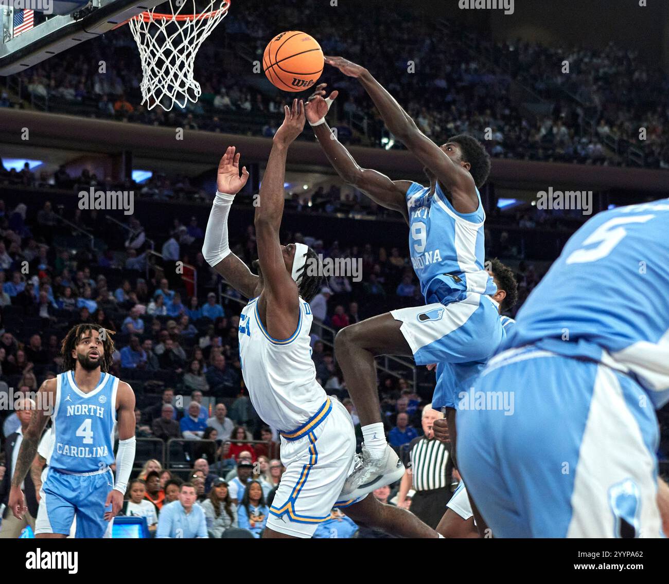 North Carolina Tar Heels guard Drake Powell (9) blocks UCLA Bruins ...
