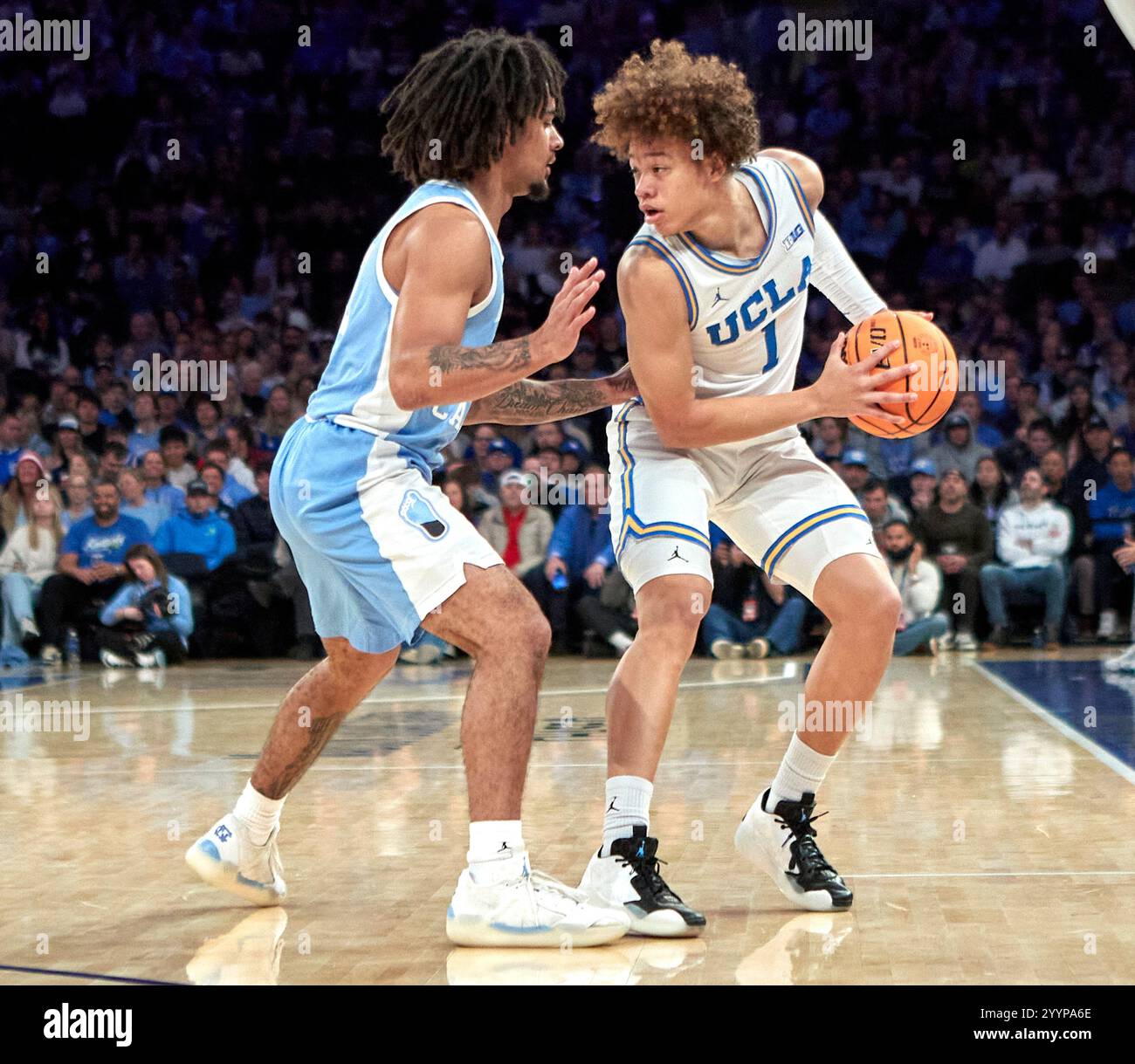 UCLA Bruins guard Trent Perry (1) is defended by North Carolina Tar ...