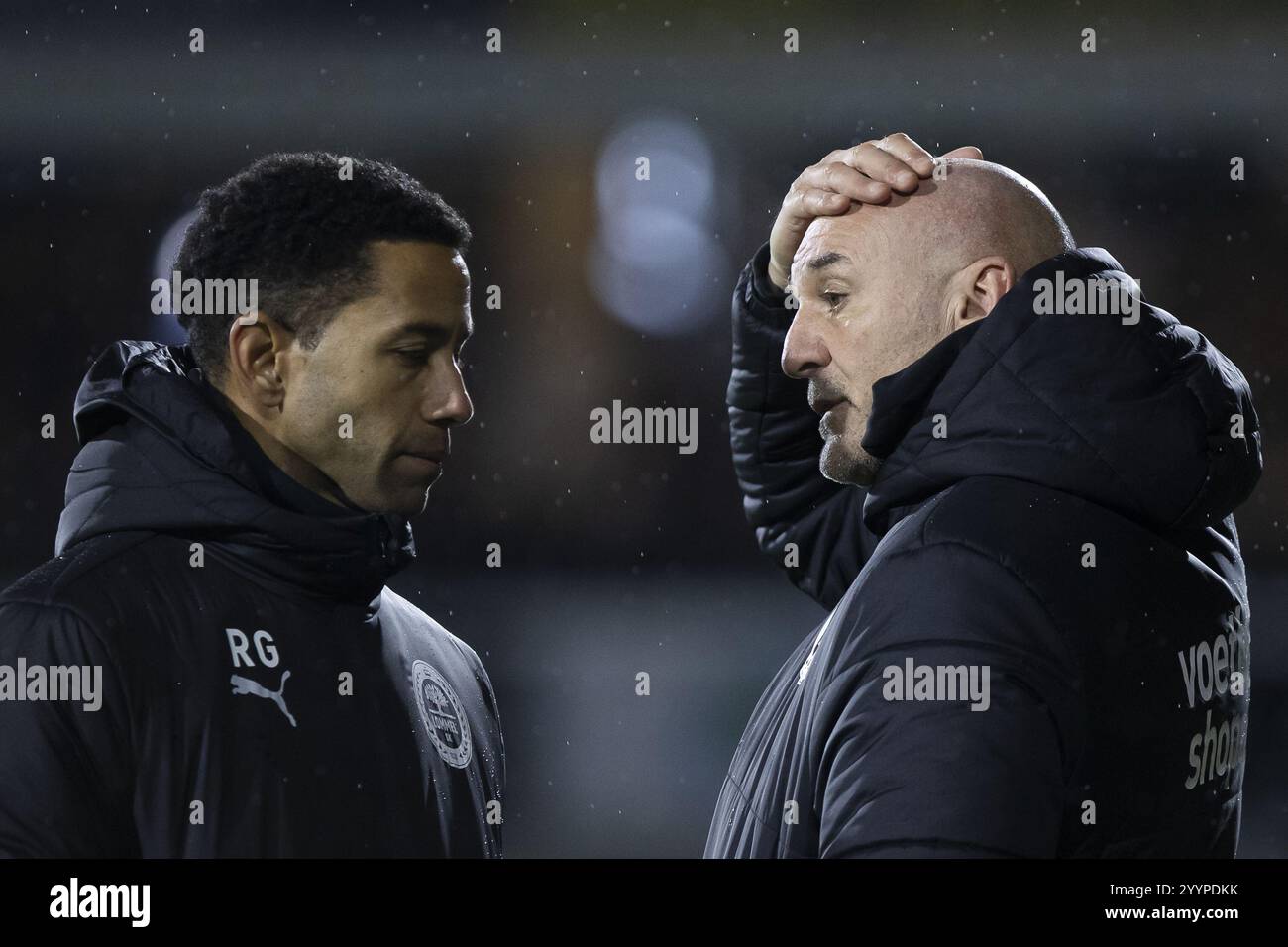 Lier, Belgium. 22nd Dec, 2024. Lommel's assistant coach Garry Ryan and ...