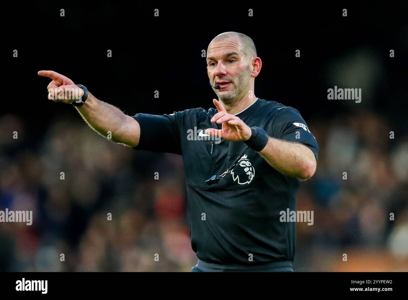 London, UK. 22nd Dec, 2024. Referee Tim Robinson gives instructions ...