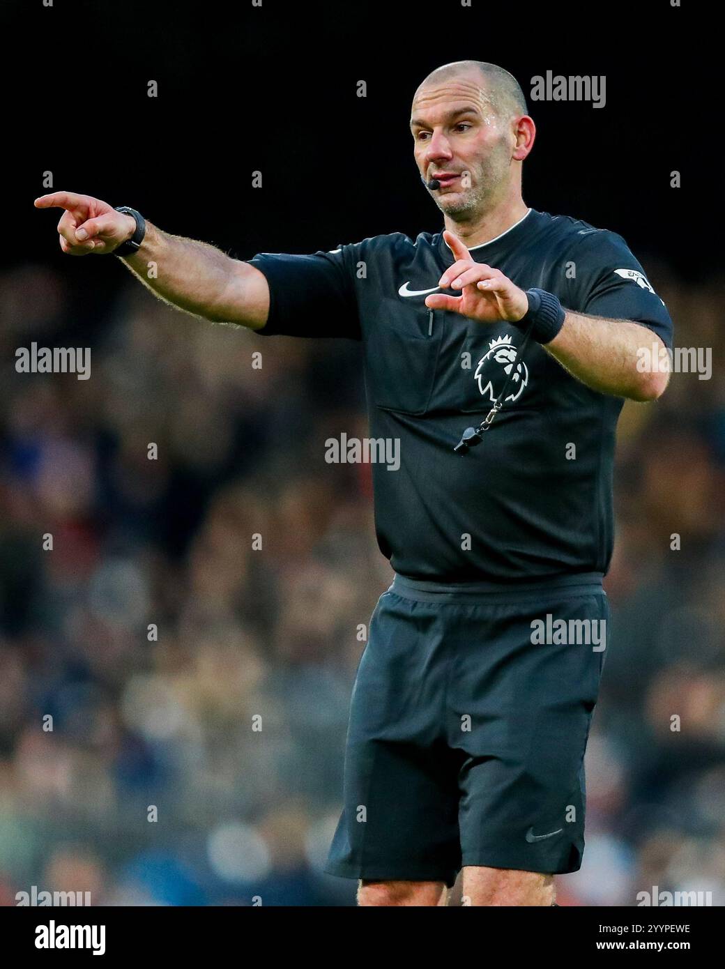 London, UK. 22nd Dec, 2024. Referee Tim Robinson gives instructions ...