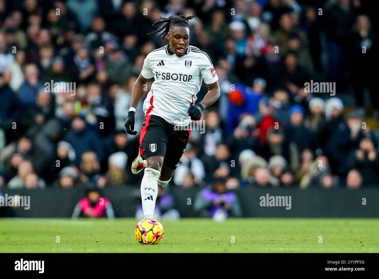 London, UK. 22nd Dec, 2024. Calvin Bassey of Fulham runs with the ball ...