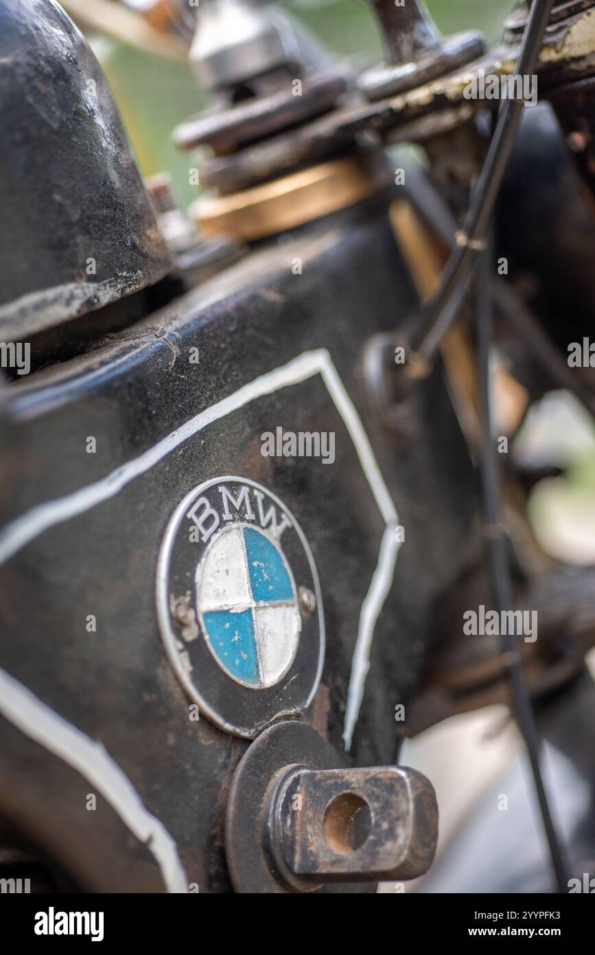 Details of an old retro motorcycle. A tattered, old, worn out logo of ...
