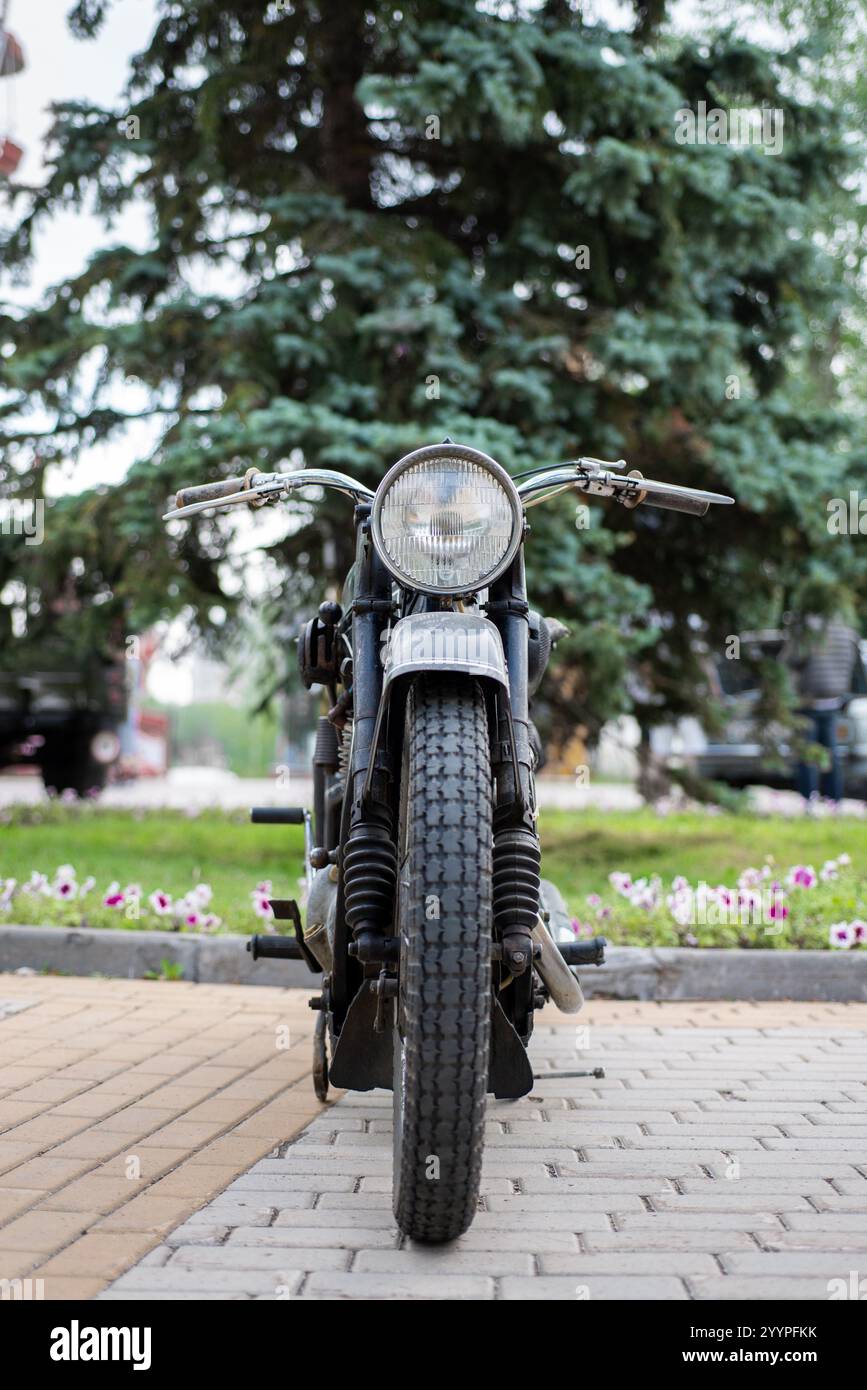 Front view of a retro BMW R35 motorcycle standing on the paving stones ...