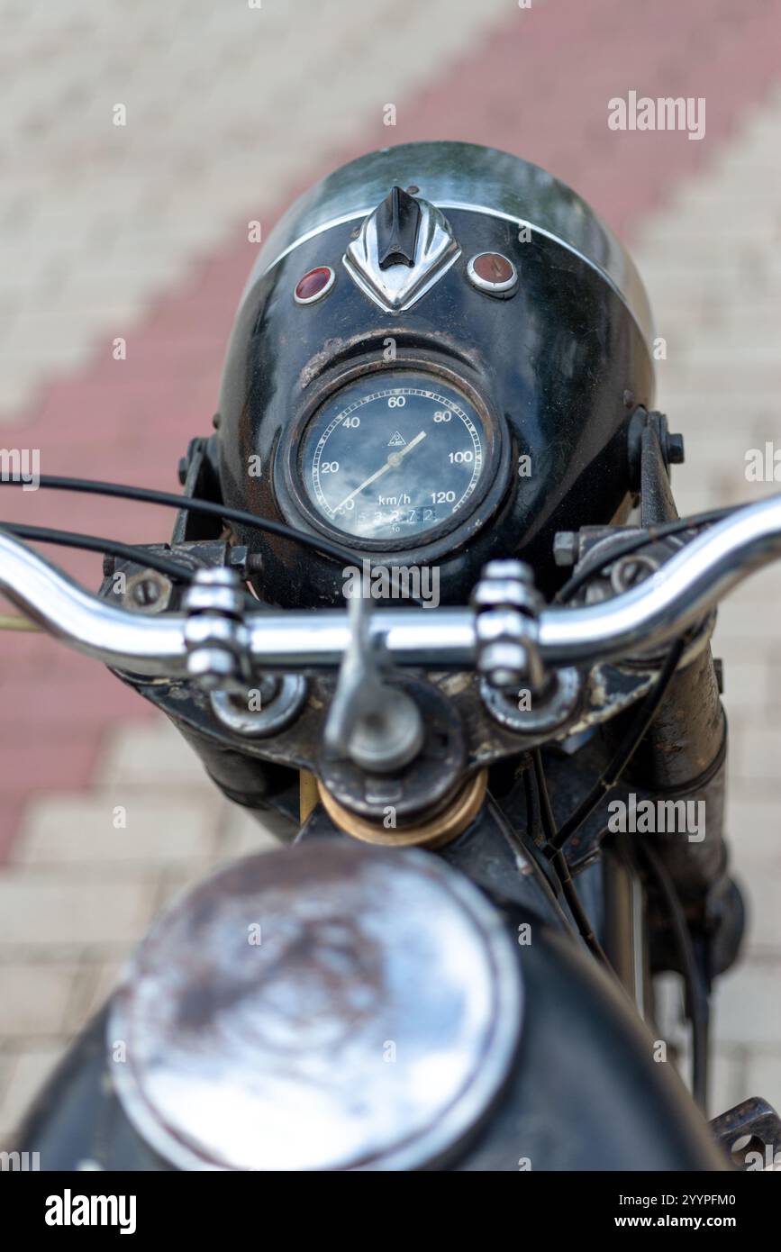 Details of an old retro motorcycle. Speedometer, steering wheel and ...