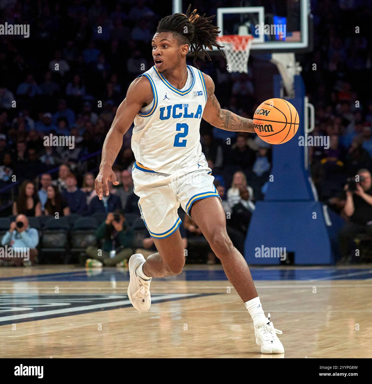 UCLA Bruins guard Dylan Andrews (2) brings the ball up court against ...