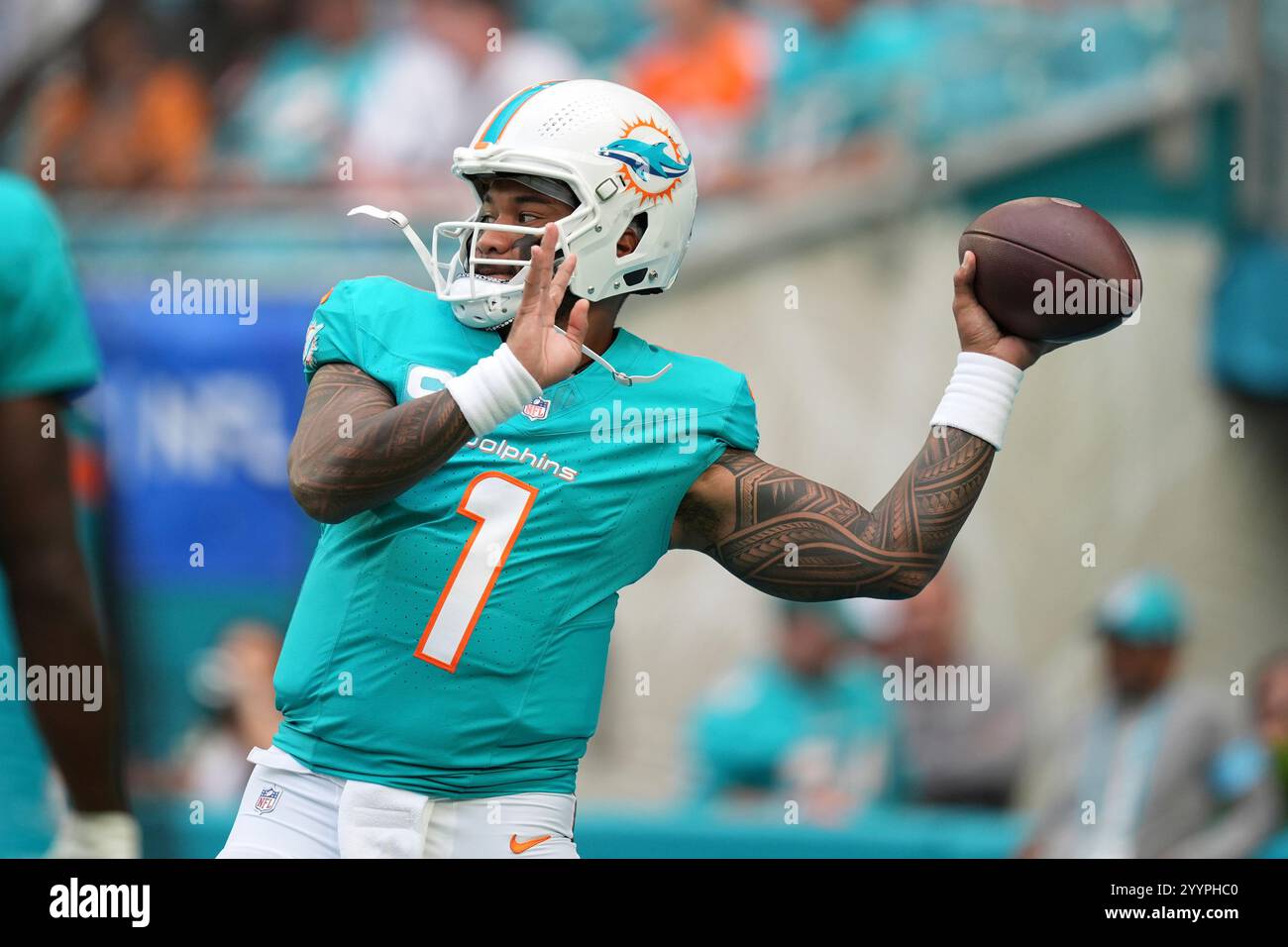 Miami Dolphins quarterback Tua Tagovailoa (1) warms up before an NFL ...