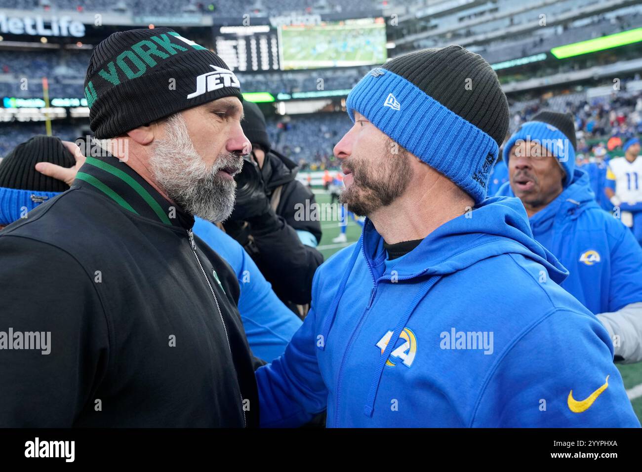 New York Jets interim head coach Jeff Ulbrich, left, talks with Los ...